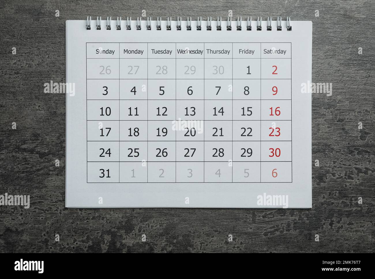 Paper calendar on grey stone background, top view Stock Photo - Alamy