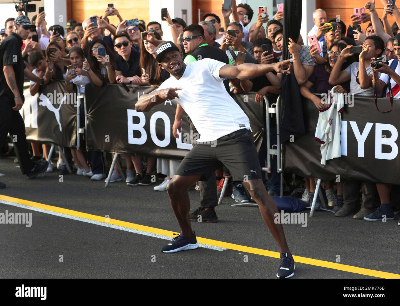 Jamaican sprinter Usain Bolt strikes his now-famous victory pose after ...