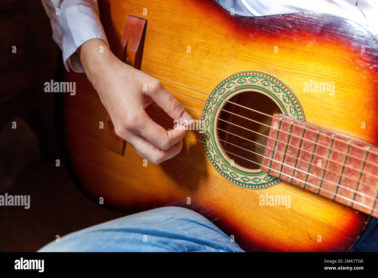 Young hipster woman hands playing guitar at home. Teen girl learning to ...