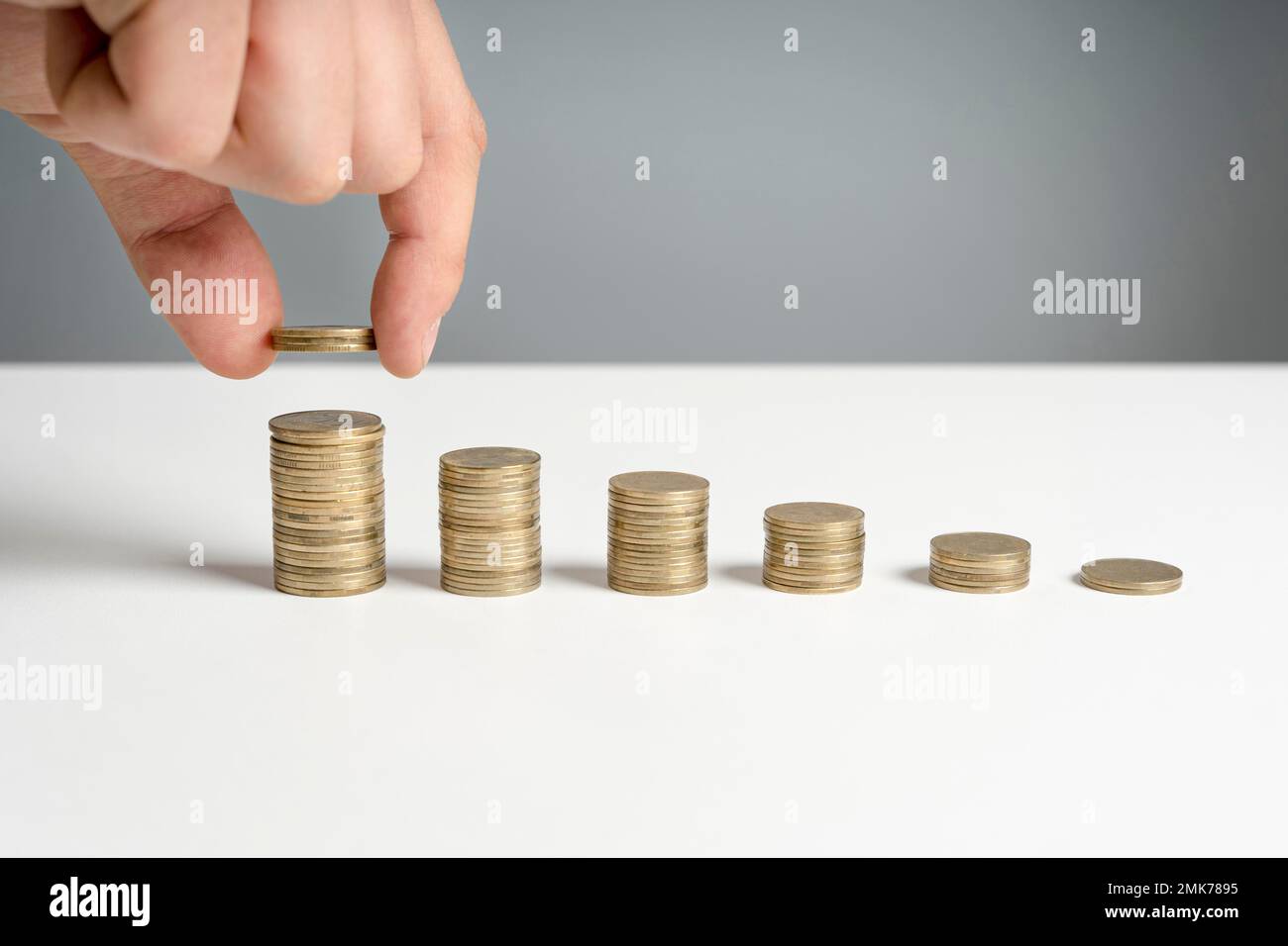 Businessman stacks coins hi-res stock photography and images - Alamy