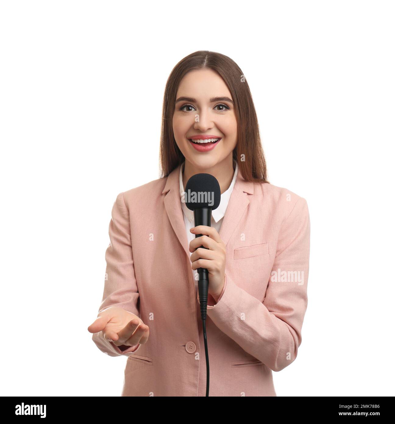 Young female journalist with microphone on white background Stock Photo ...