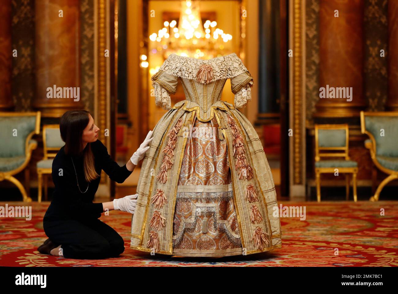 A member of the Palace staff arranges Queen Victoria's Stuart Ball ...