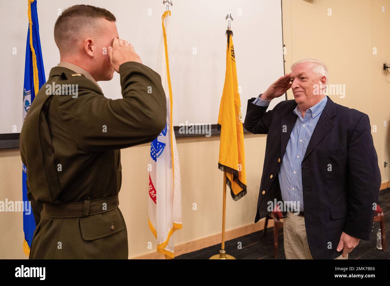 U.S. Army 2nd Lt. Luke Mooney, left, an infantry officer, renders his ...