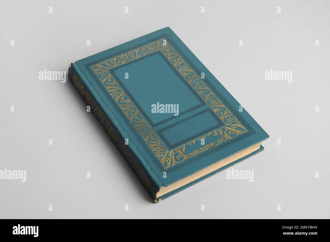 Hardcover book on light grey background. Space for design Stock Photo ...