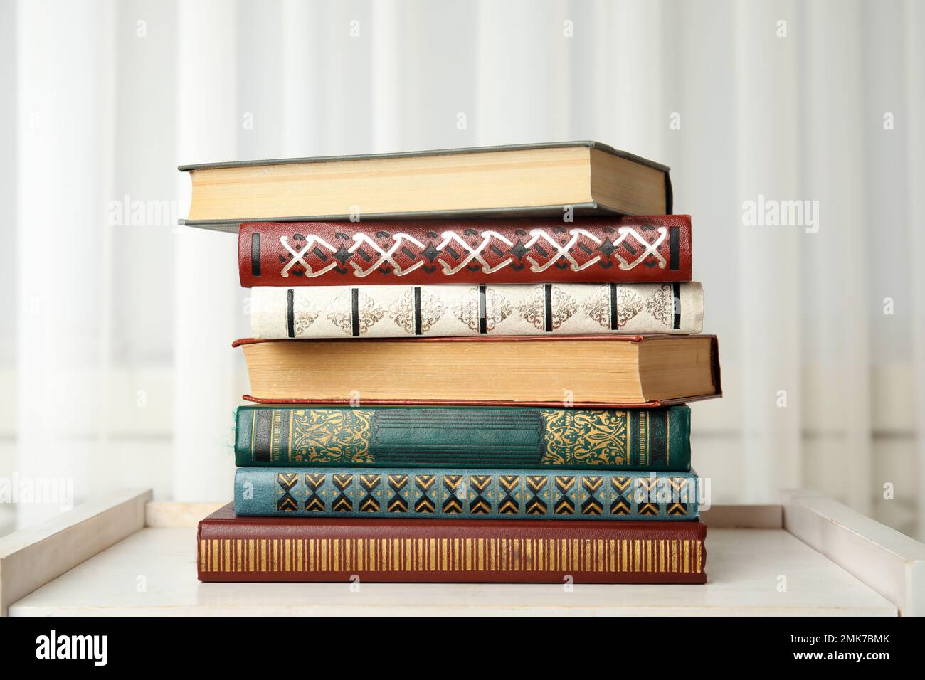 Collection of different books on table indoors Stock Photo - Alamy