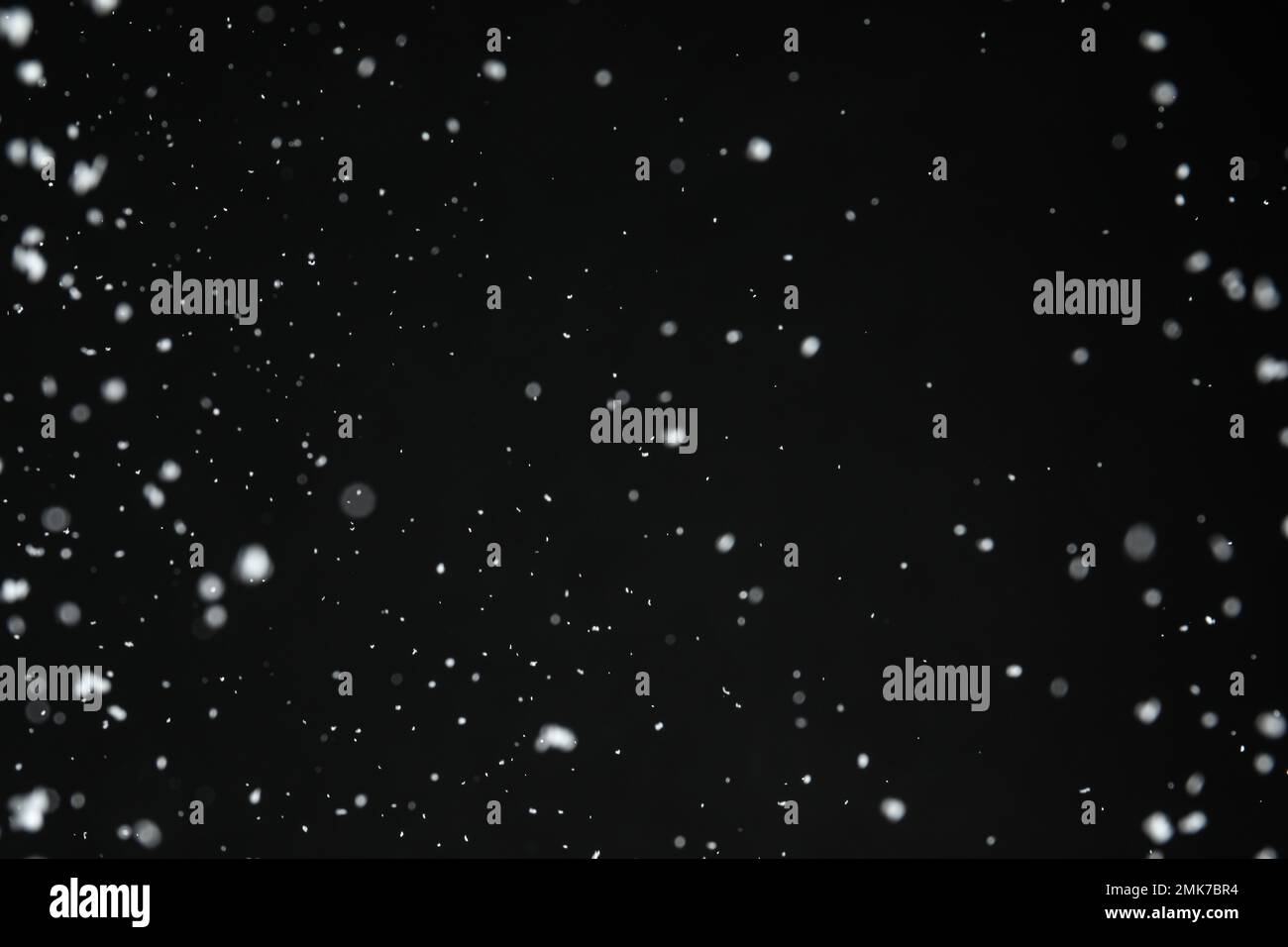 Snow falling down on black hi-res stock photography and images - Alamy