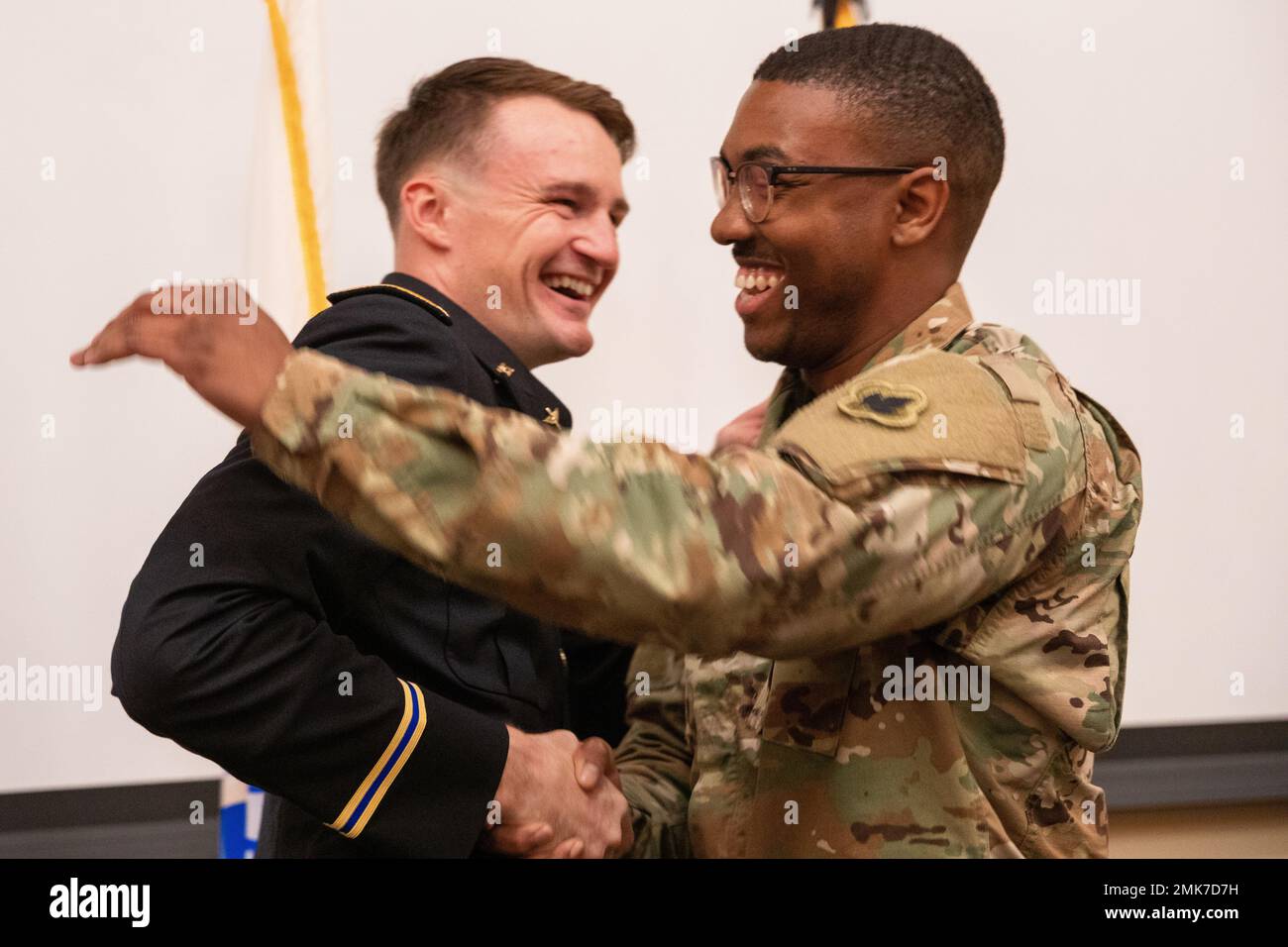 U.S. Army 2nd Lt. Phil Rudak, left, an aviation officer, shakes hands ...
