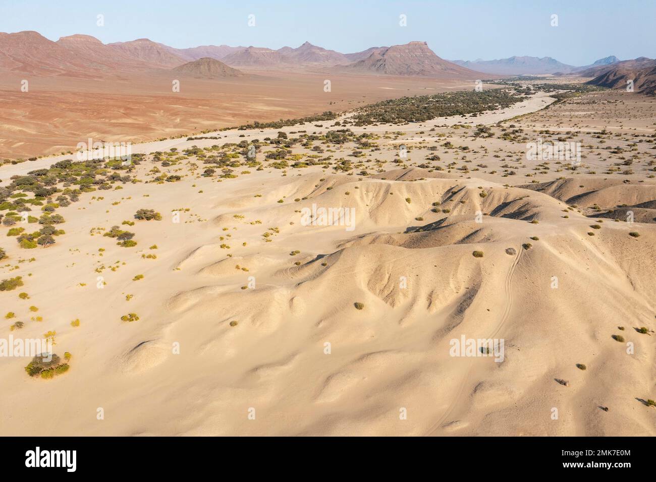 The dry bed of the Hoarusib river and adjoining badlands, aerial view ...