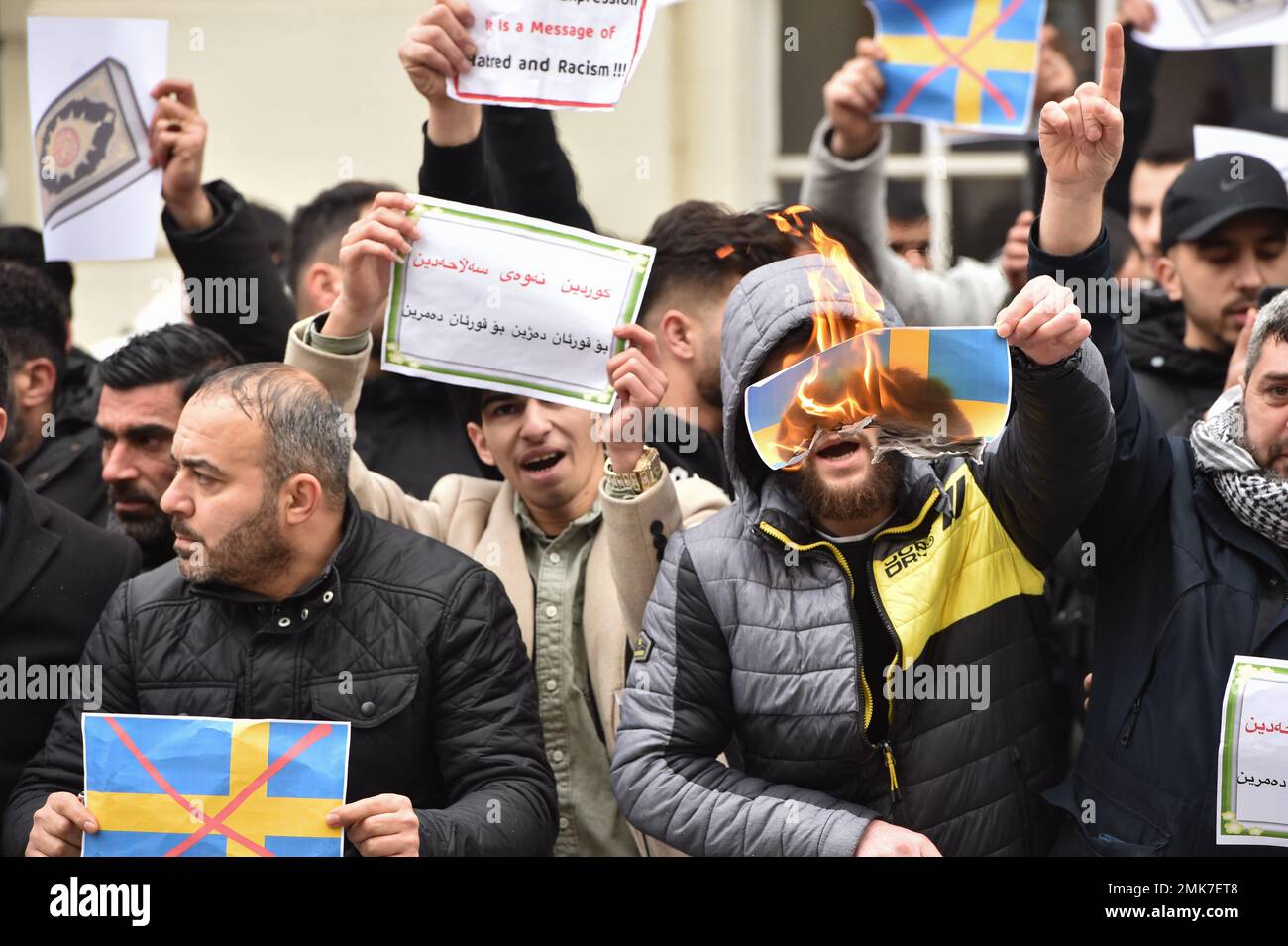 London, England, UK. 28th Jan, 2023. Muslim protesters burn Swedish ...