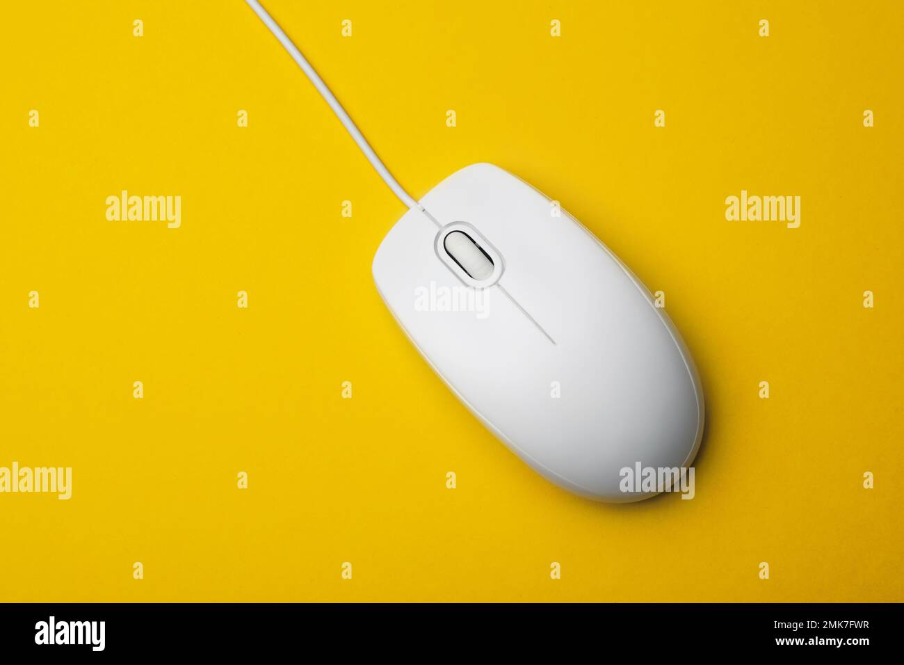 Wired computer mouse on yellow background, top view Stock Photo - Alamy