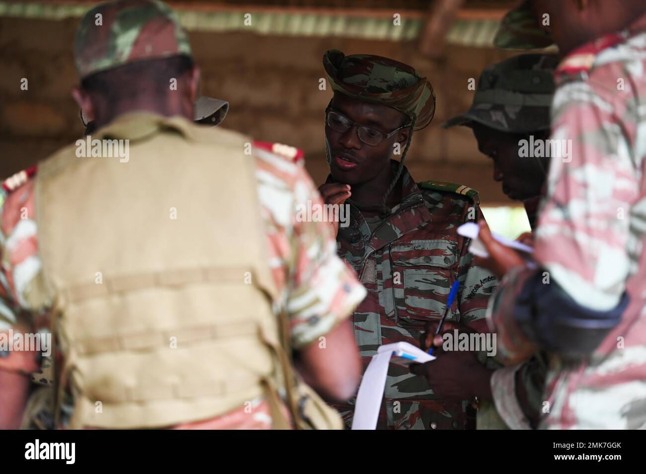 Beninese soldiers from the 1st Commando Parachute Battalion discuss ...