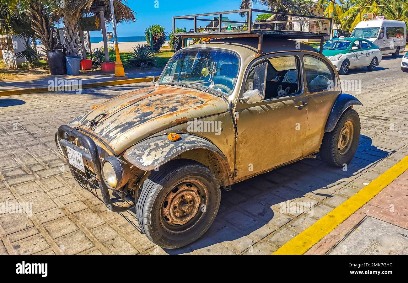 Various colorful old broken rusty and damaged cars and classic vintage ...