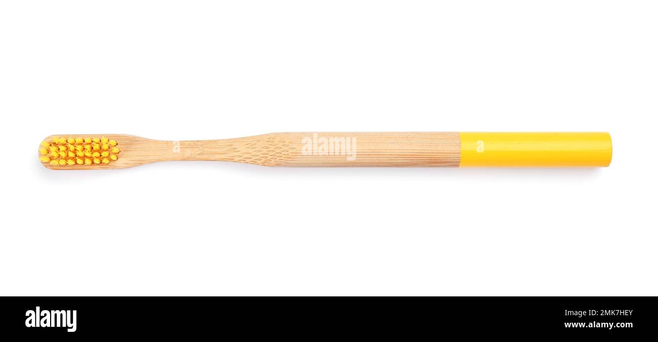 Bamboo toothbrush with yellow bristle isolated on white, top view Stock ...