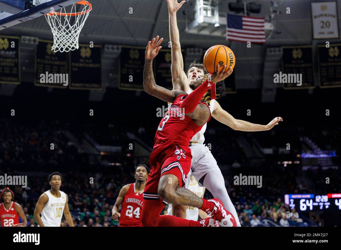 South Bend, Indiana, USA. 28th Jan, 2023. Louisville guard El Ellis (3) goes up for a shot as ...