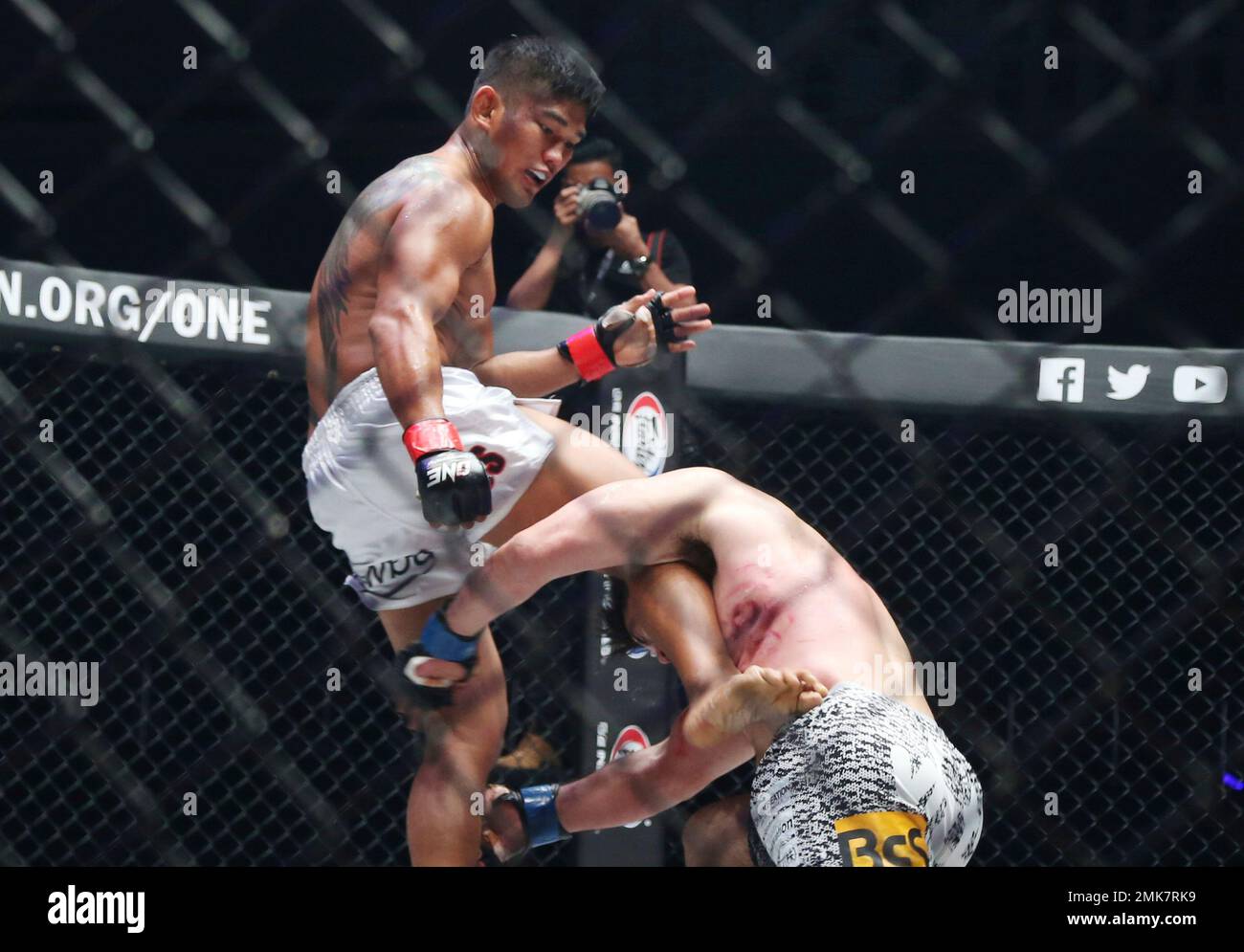Mixed martial arts (MMA) fighters Aung La N Sang of Myanmar, left, and ...