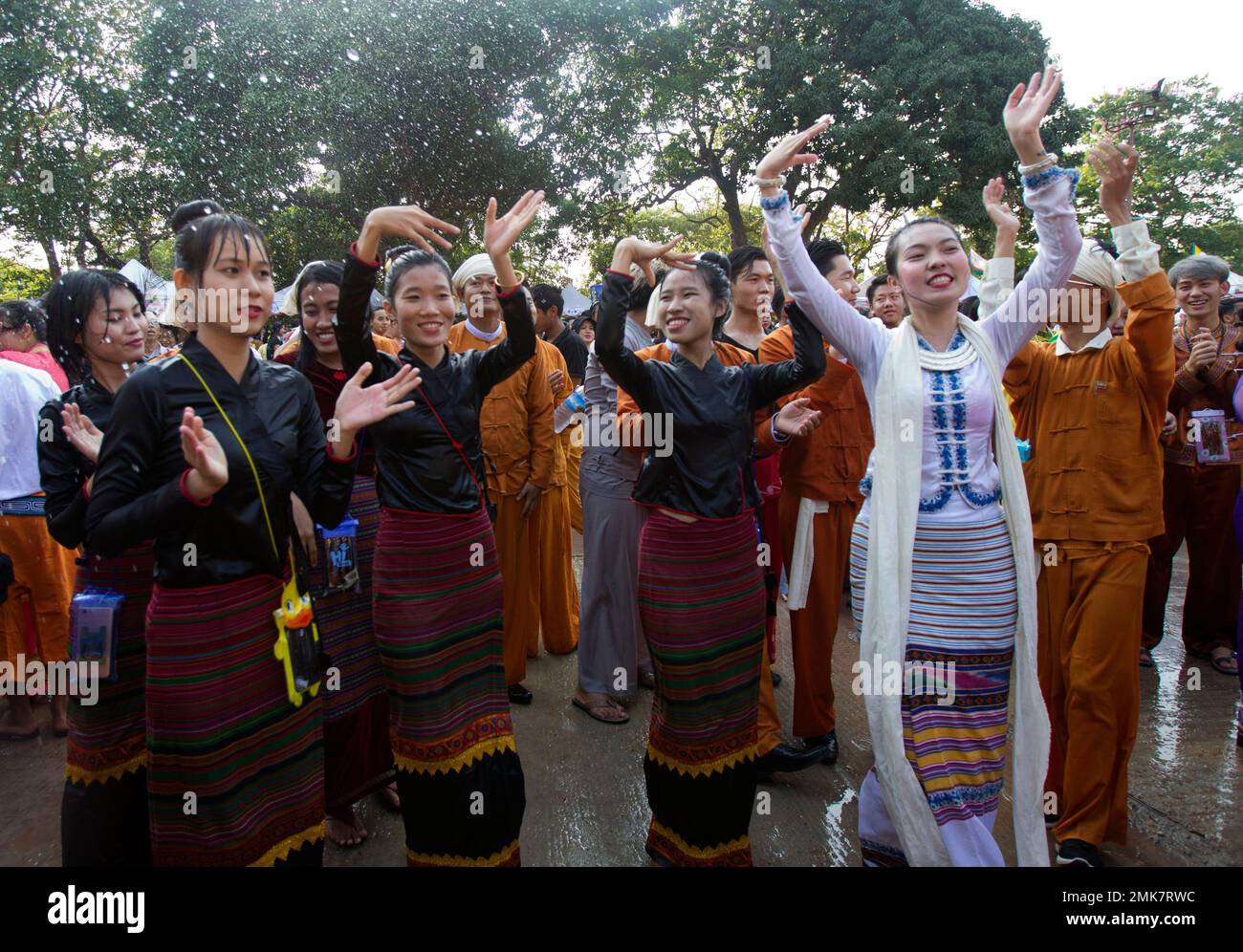 Clad in traditional attire, ethnic Shan people dance during a ...
