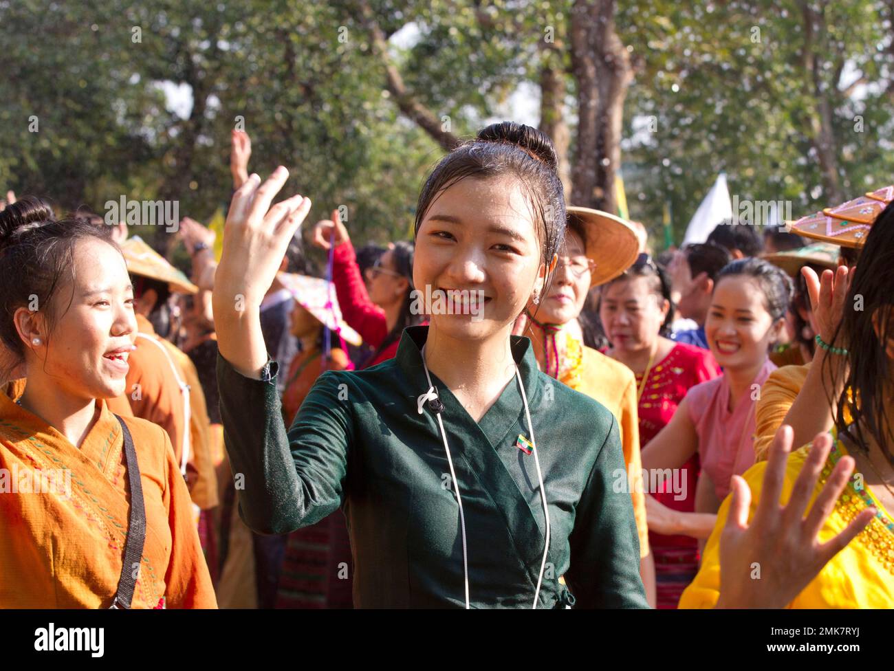 Clad in traditional attire, ethnic Shan people dance during a ...