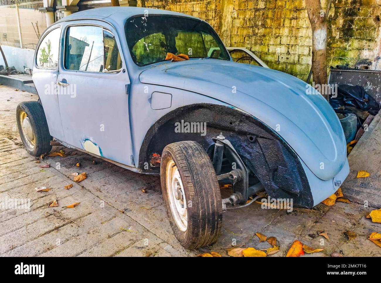 Various colorful old broken rusty and damaged cars and classic vintage ...