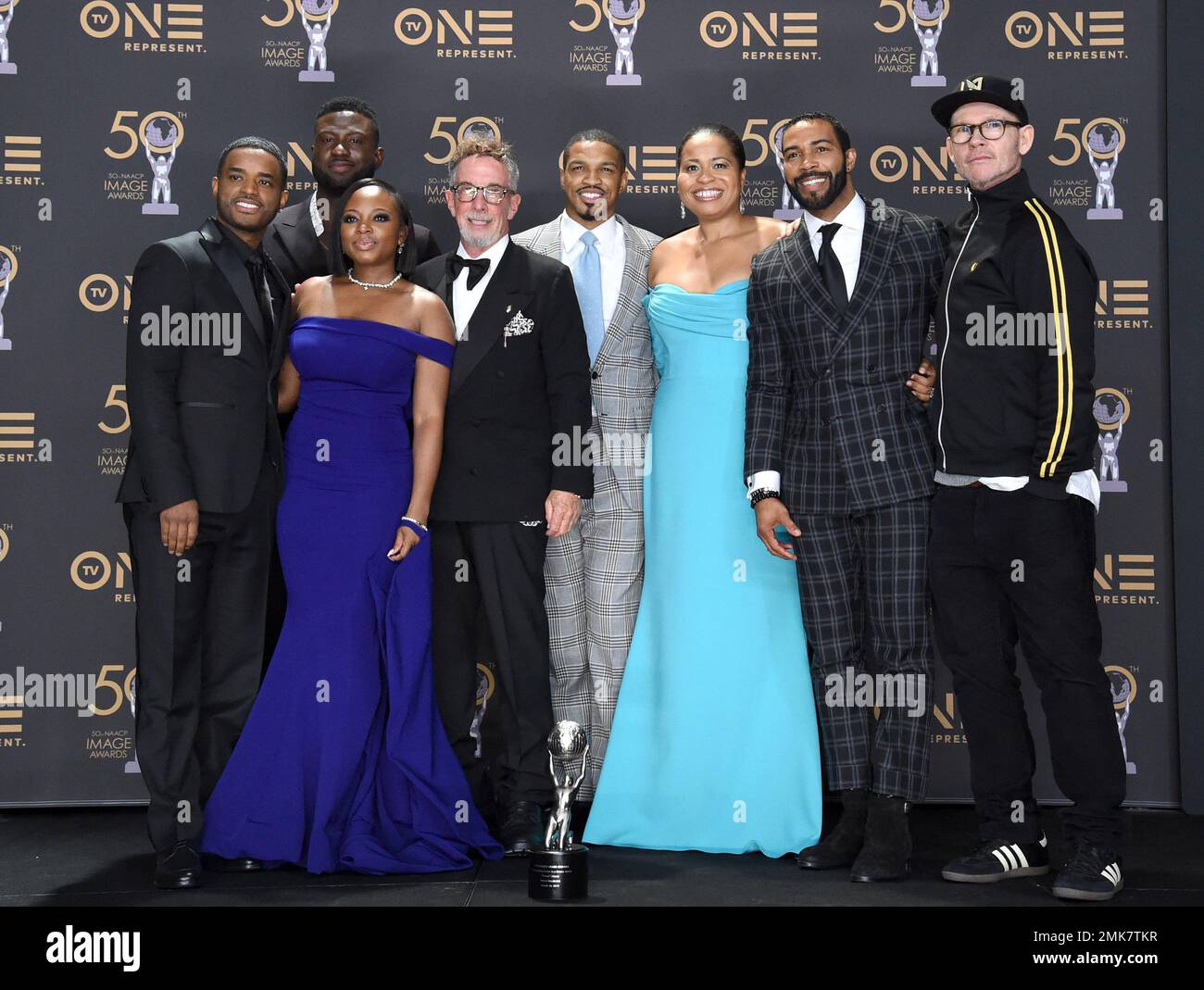 The cast and crew of "Power," pose in the press room with the award for ...