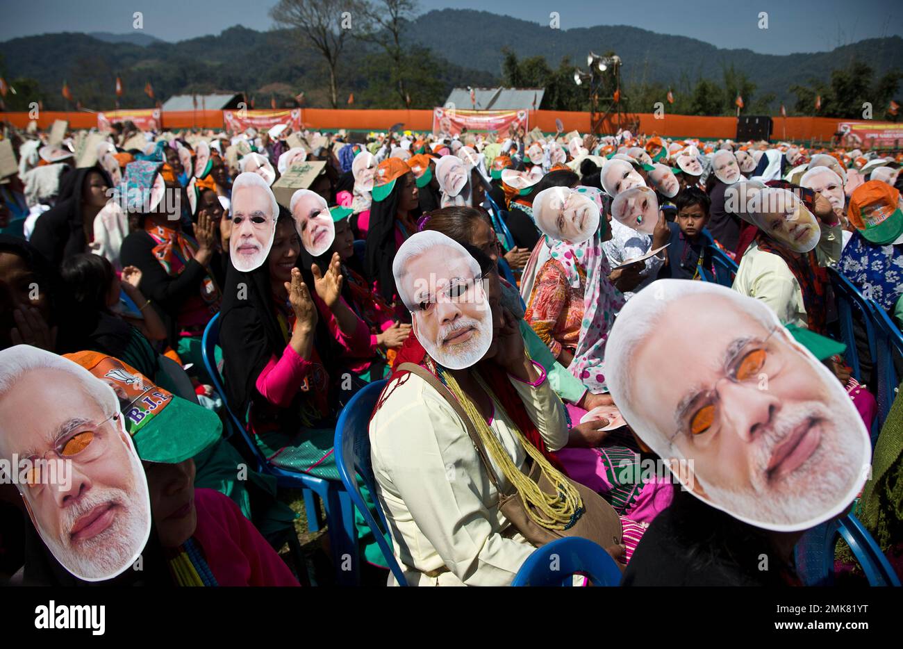 Supporters of ruling Bharatiya Janata Party (BJP) wear face masks ...