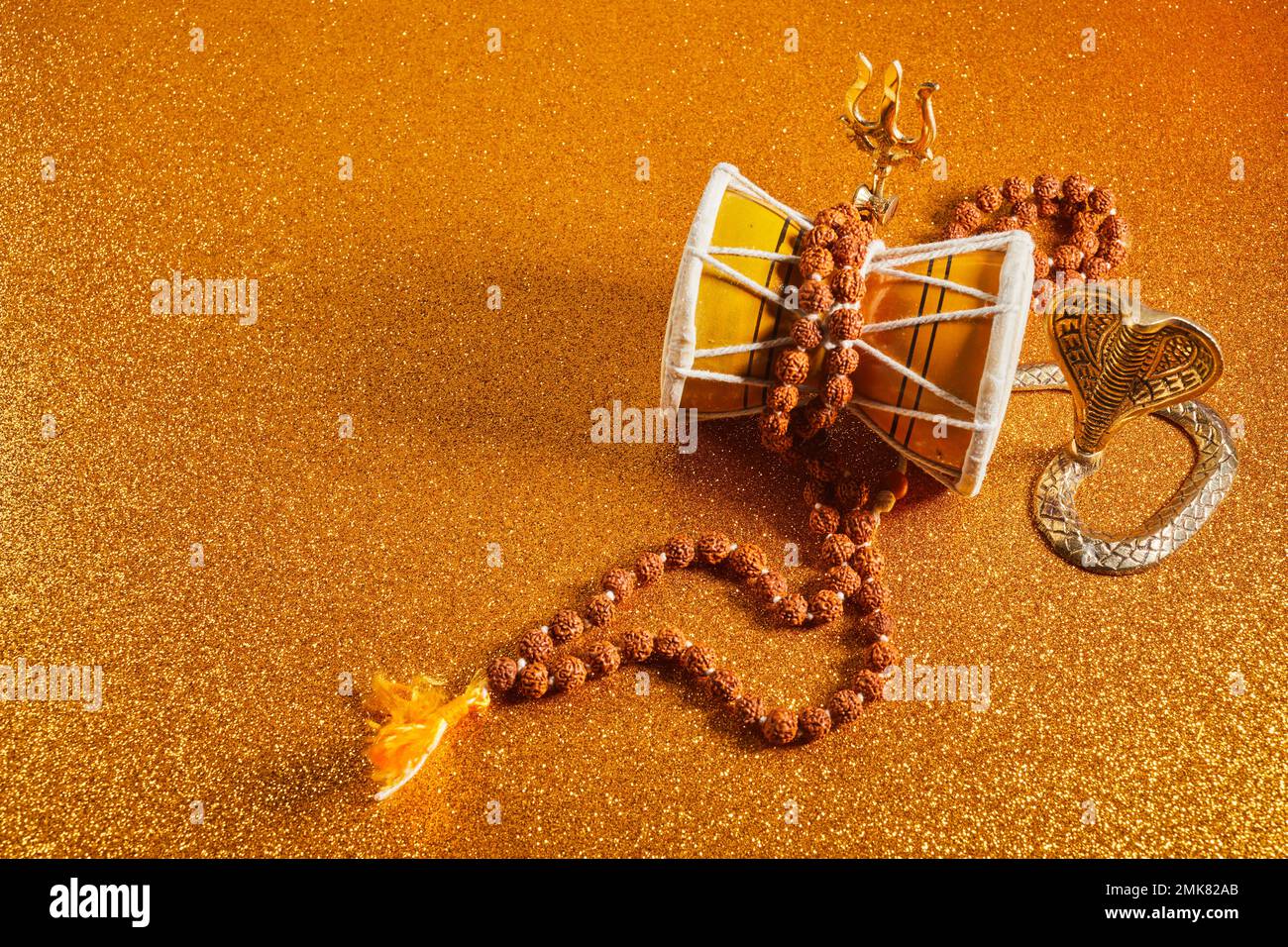 Shivaratri background with Shivas trident and Pellet Drum Damroo ...