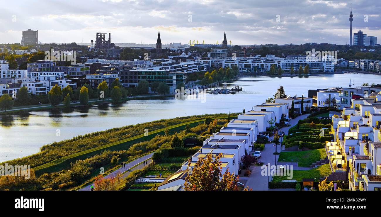 Residential development at Phoenix Lake with the city silouhette in the ...