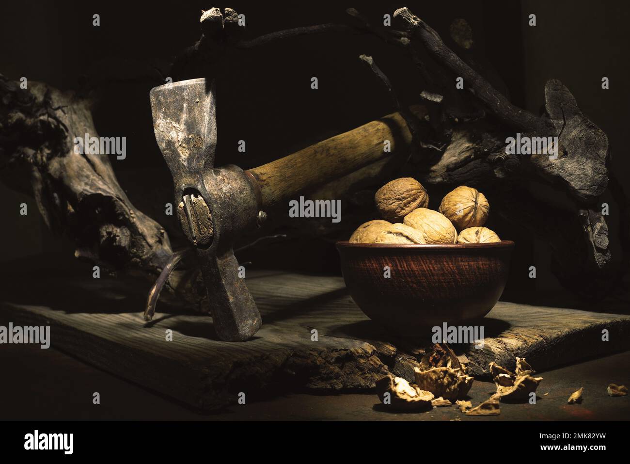 Still life with hammer and walnuts. Crack walnuts. Walnut shell. Chop ...