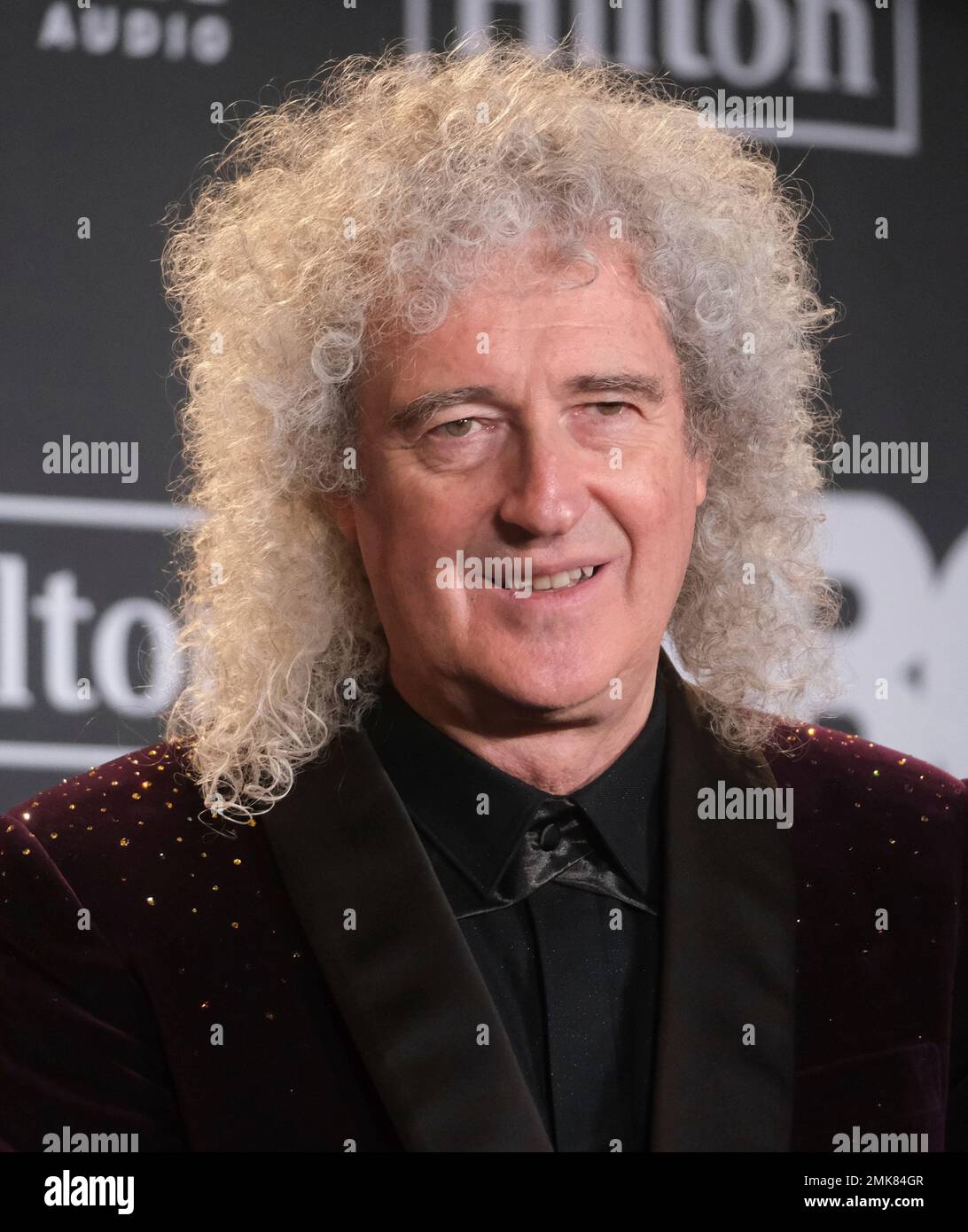 Brian May, of Queen, poses in the press room at the Rock & Roll Hall of ...