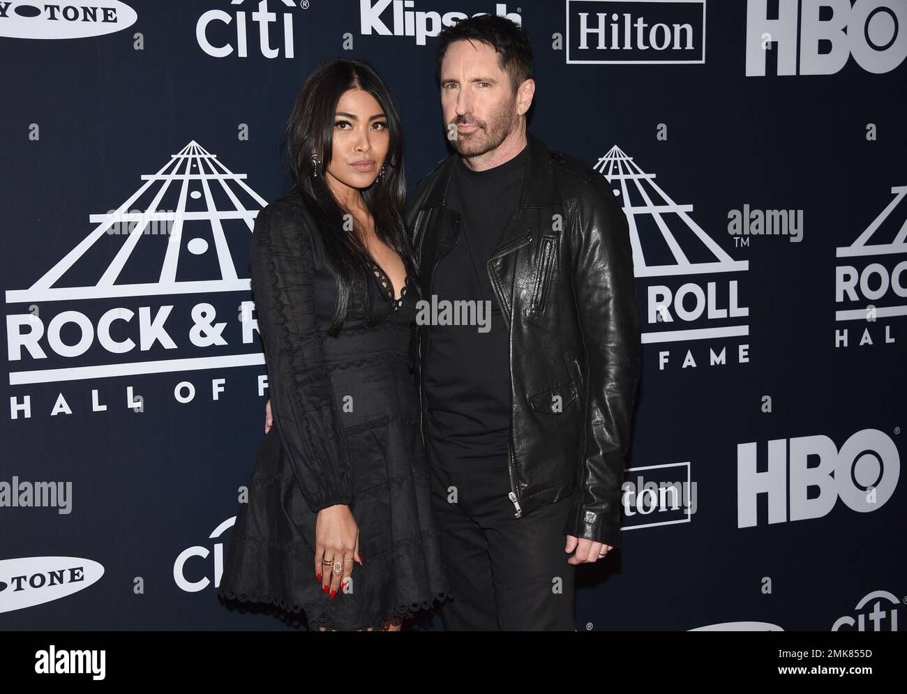Trent Reznor, right, and Mariqueen Maandig Reznor arrive at the Rock ...