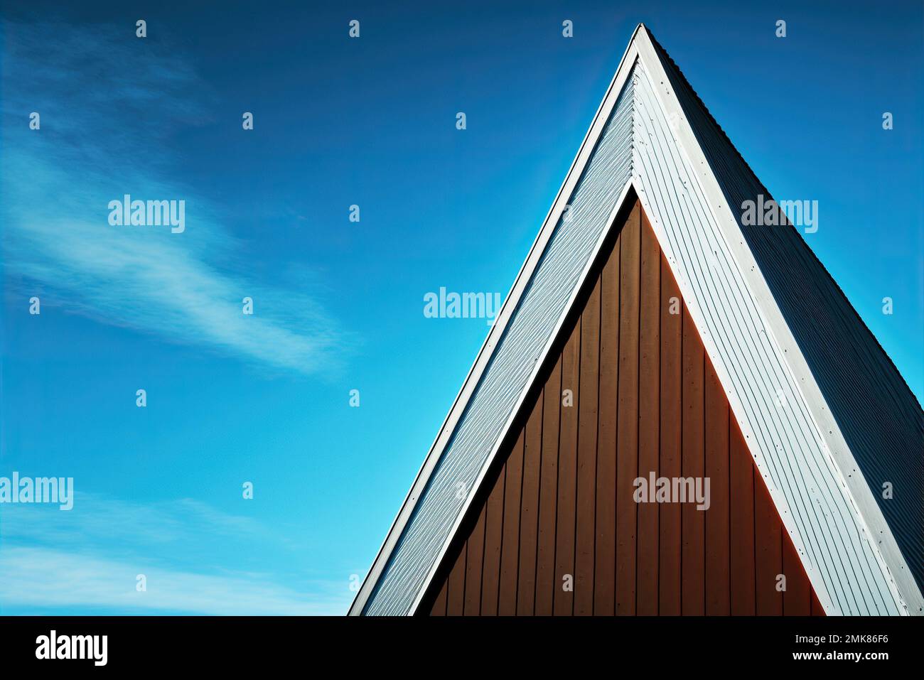 Photograph of the pointed gabled roof of a modern design of a house, in ...