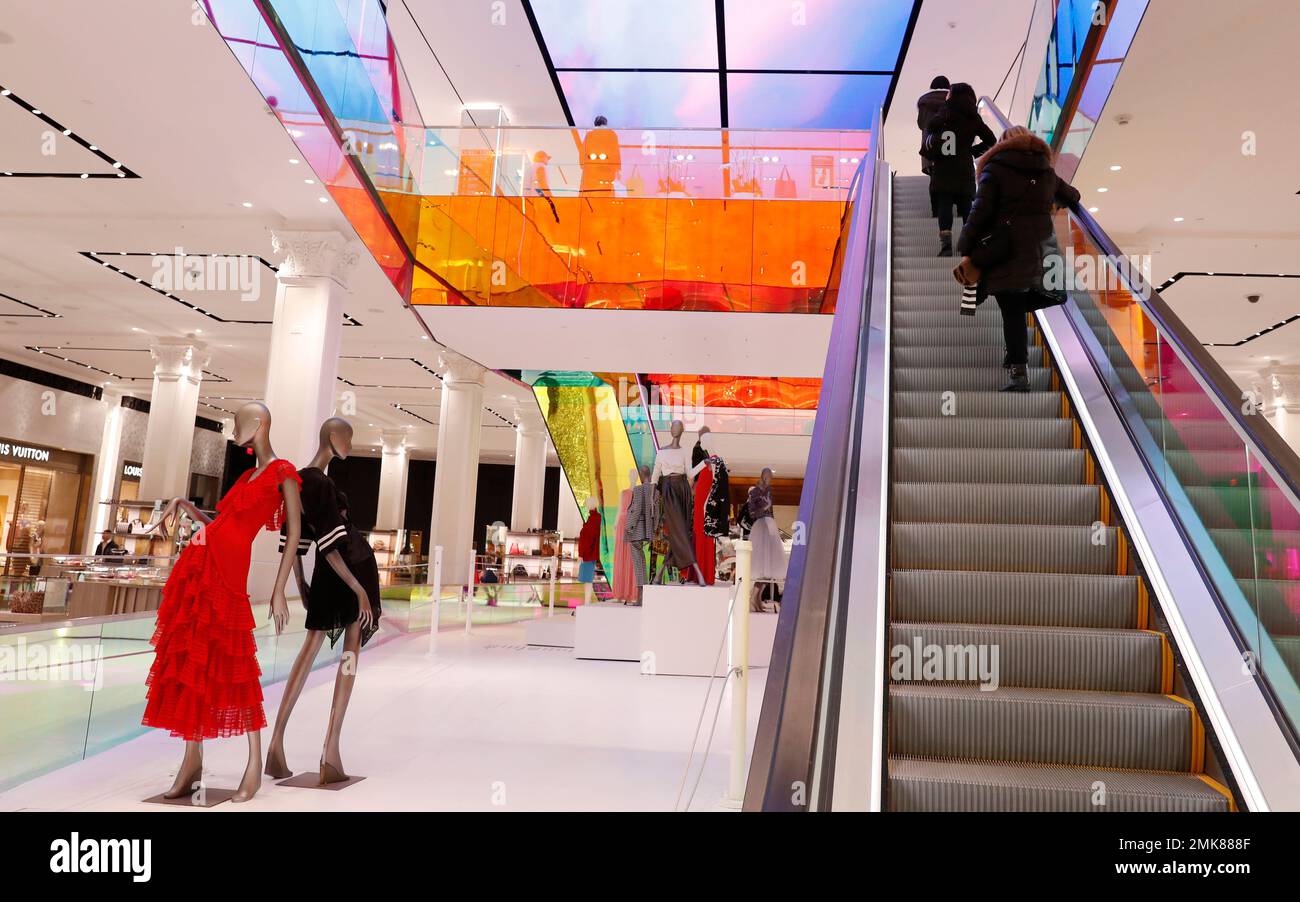 FILE- In this Feb. 20, 2019, file photo shoppers ride the escalator at ...
