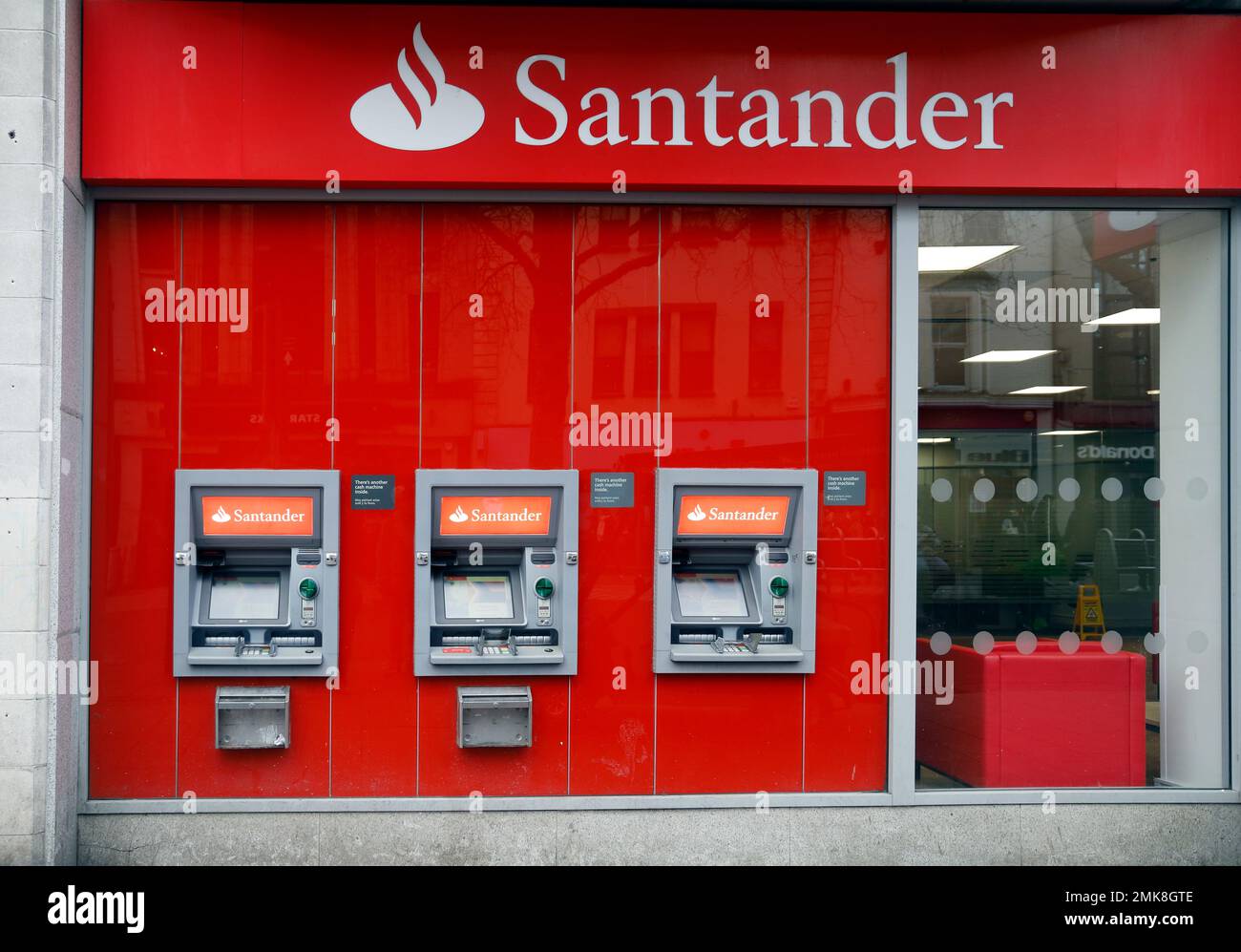 Santander bank frontage and three ATM machines. Queen Street, Cardiff ...