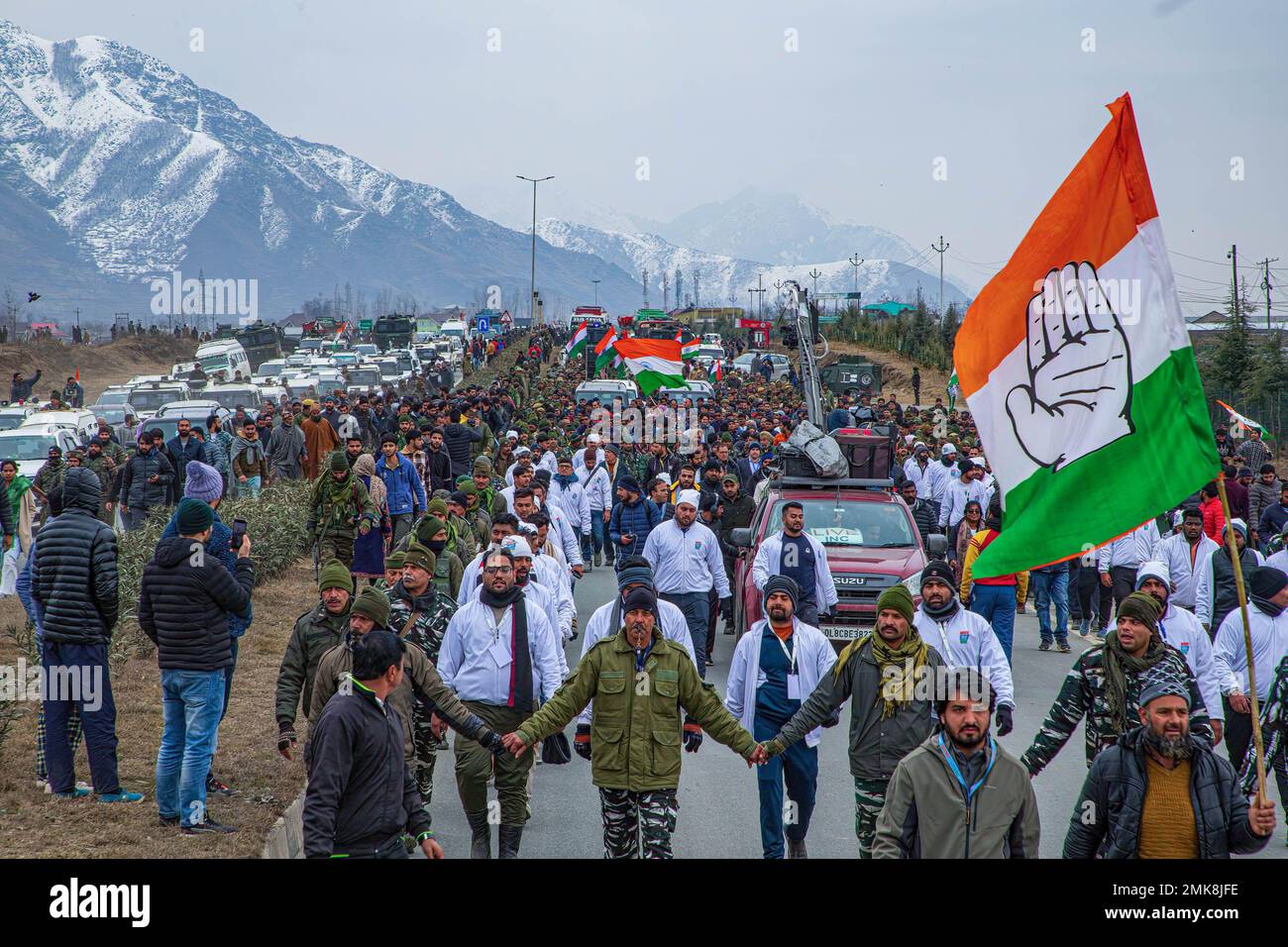People walk along the Indian Congress Leader Rahul Gandhi and former ...