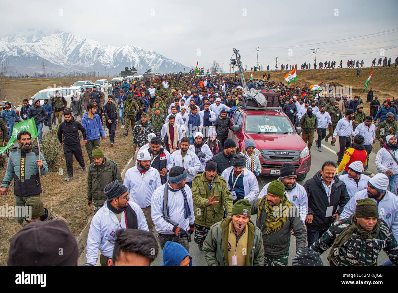People walk along the Indian Congress Leader Rahul Gandhi and former ...