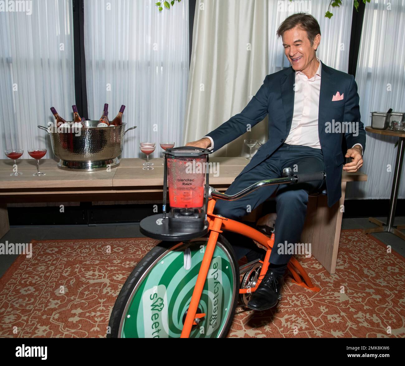 Dr. Mehmet Oz uses peddle power to blend a drink at "A Toast to Kathie ...