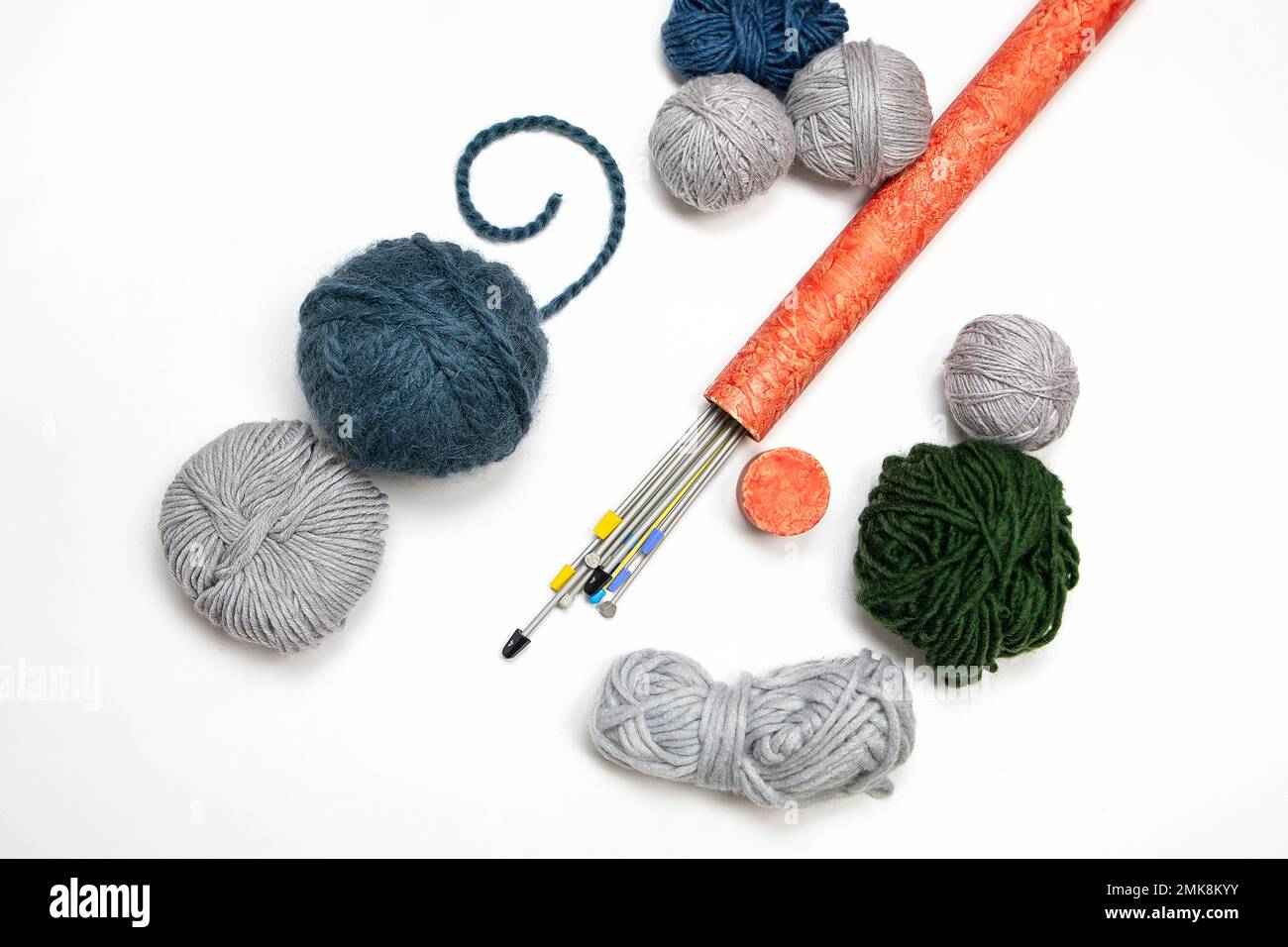 Knitting background. Set of Knitting needles, bunch of yarn in grey ...