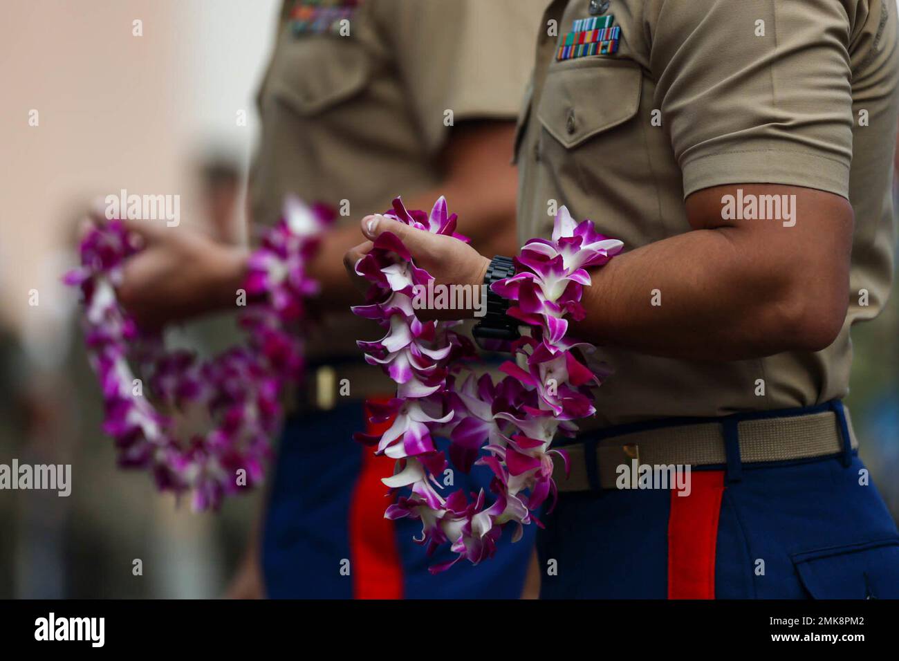 U.S. Marines prepare to present lei to Mrs. Holly Rudder and Mrs. Sue ...