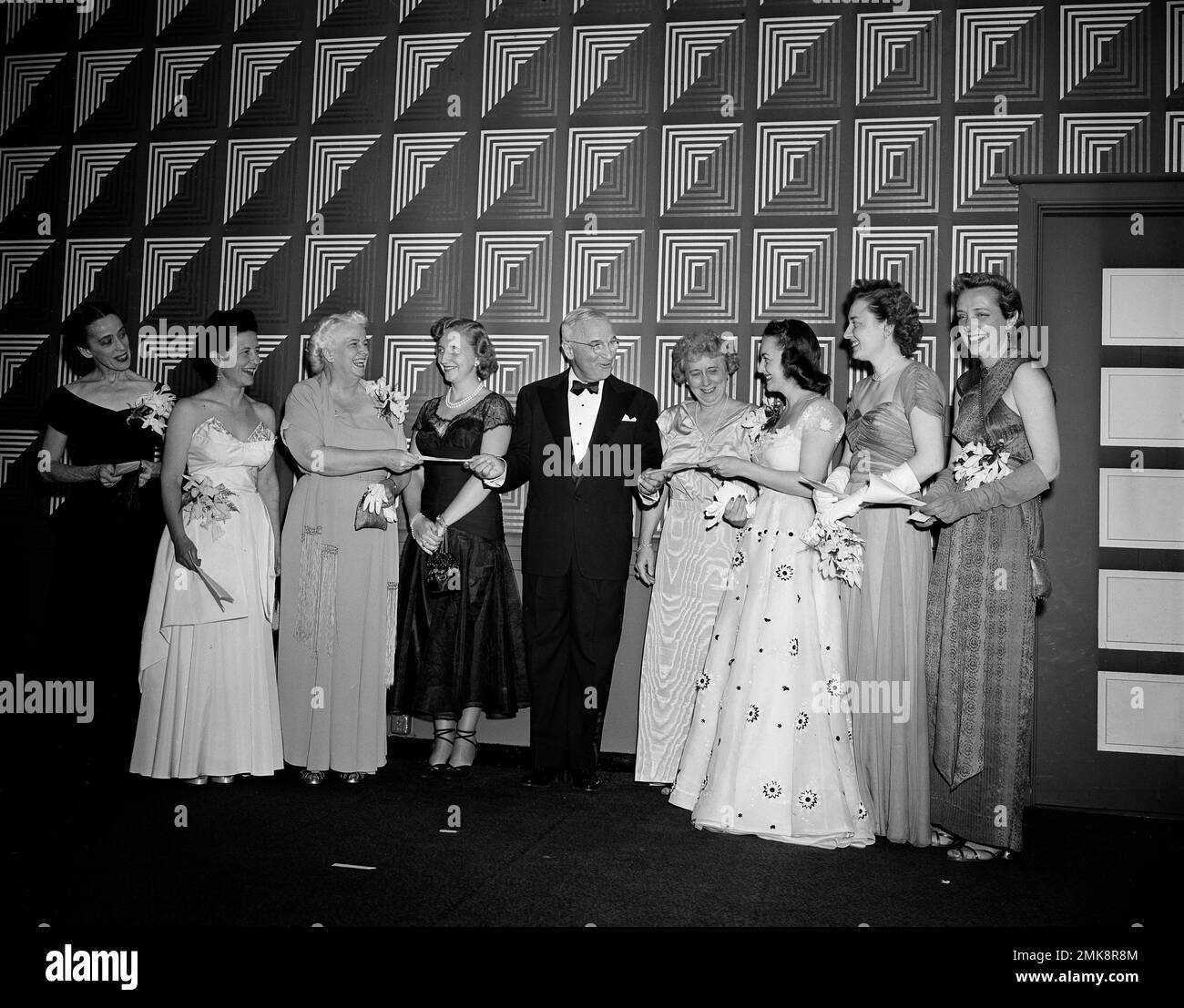President Harry S. Truman poses with six women picked by the Women's ...