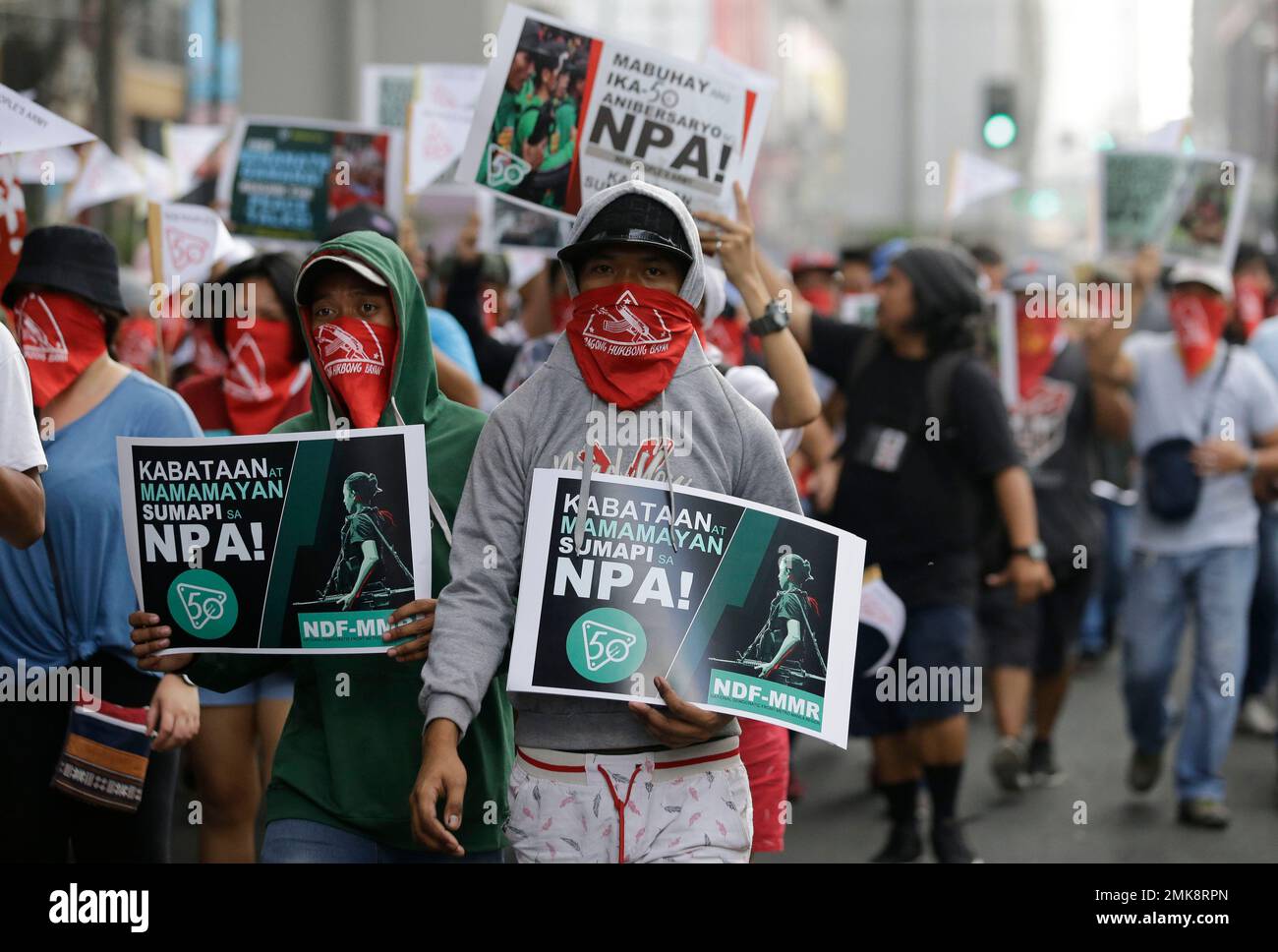 CAPTION ADDITION: ADDING DUTERTE'S TERMINATION OF TALKS: Masked members ...