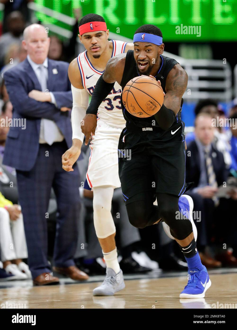 Orlando Magic's Terrence Ross, right, drives down the court in front of ...