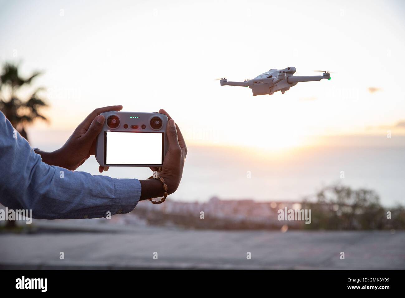 Close up on drone remote control with blank screen for mockup, drone ...