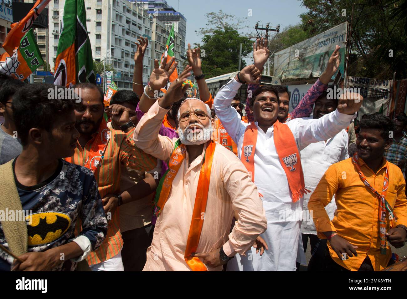 A supporter of India's ruling Bharatiya Janata Party (BJP) wearing mask ...