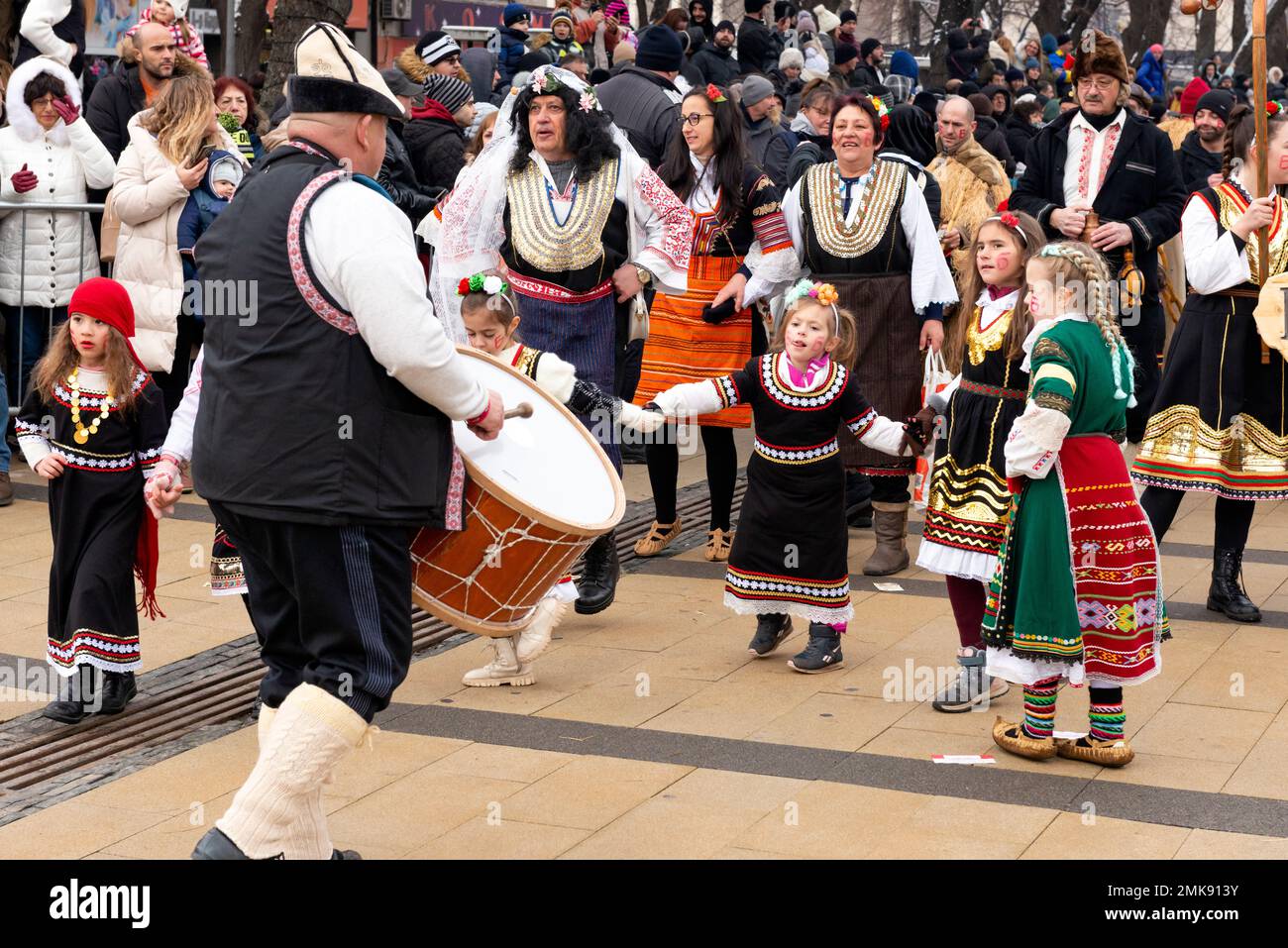 Pernik, Bulgaria. 28 January 2023. Little girls dressed in traditional ...
