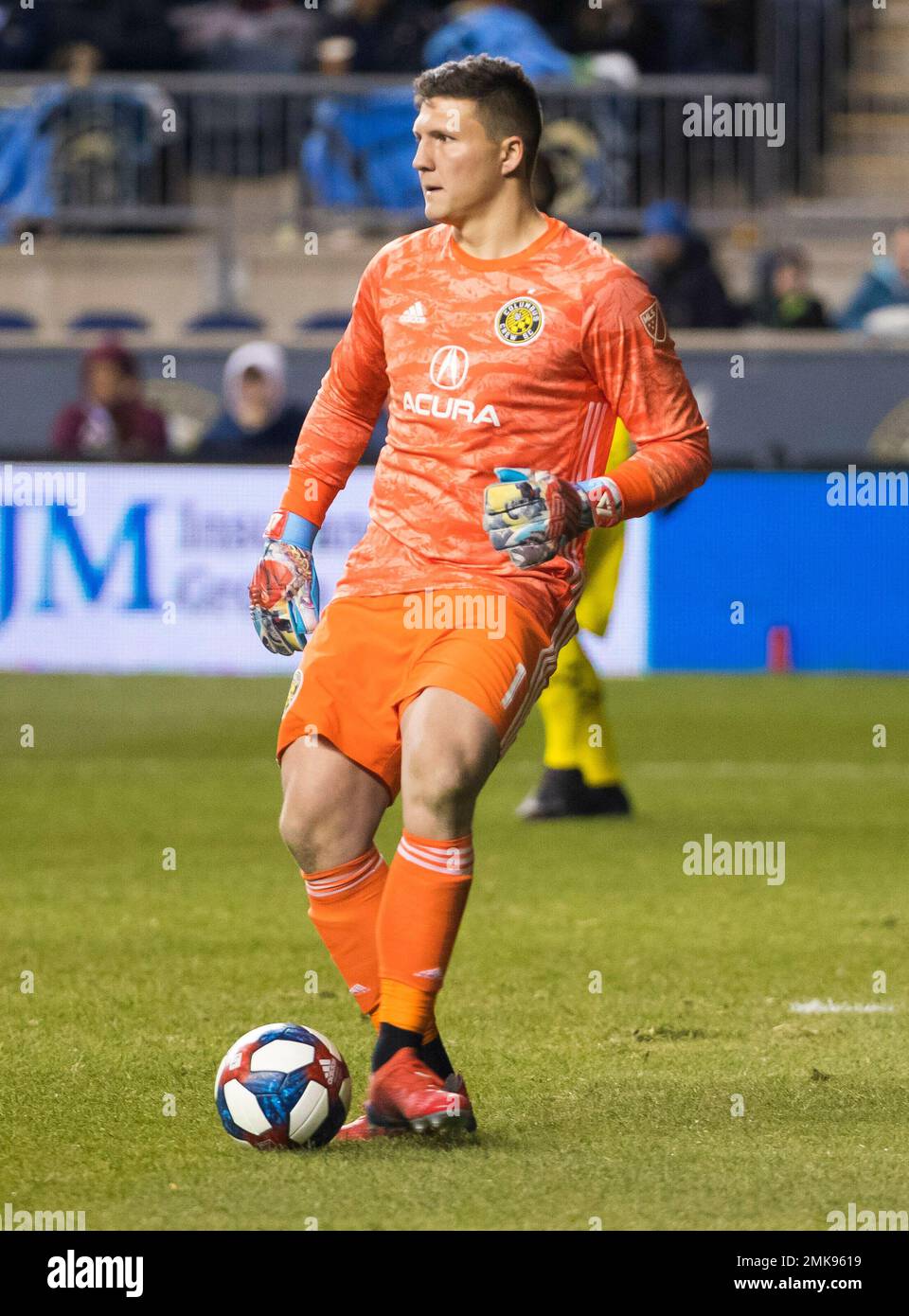 Columbus Crew's Joseph Bendik looks on before kicking the ball back ...