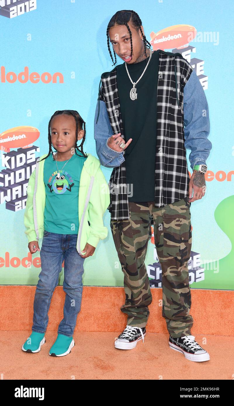 Tyga, right, and his son King Cairo arrive at the Nickelodeon Kids ...