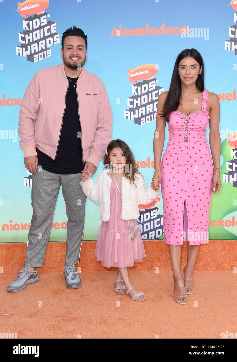 Frankie Delgado, left, and Jennifer Acosta arrive with their daughter ...