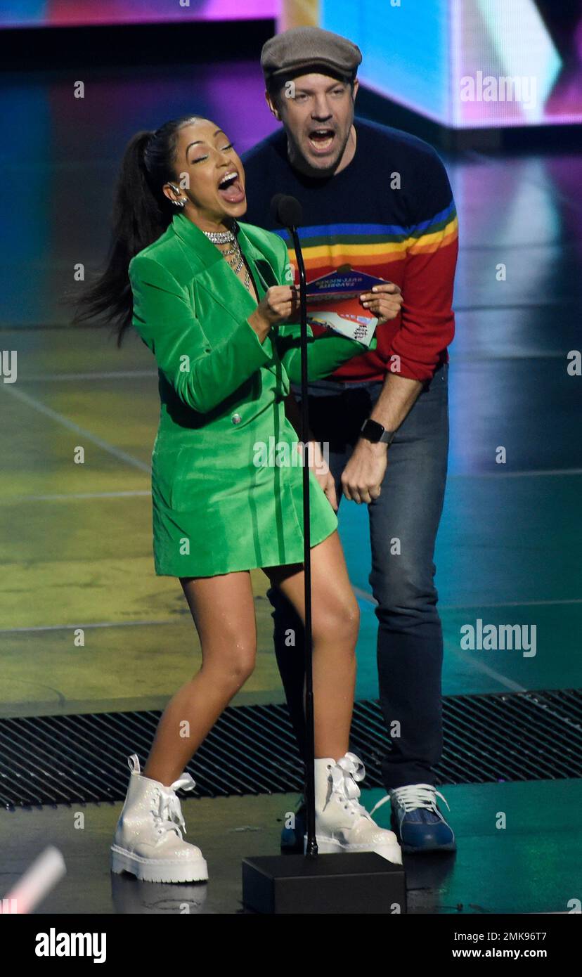 Liza Koshy, left, and Jason Sudeikis present the award for favorite butt-kicker at the ...