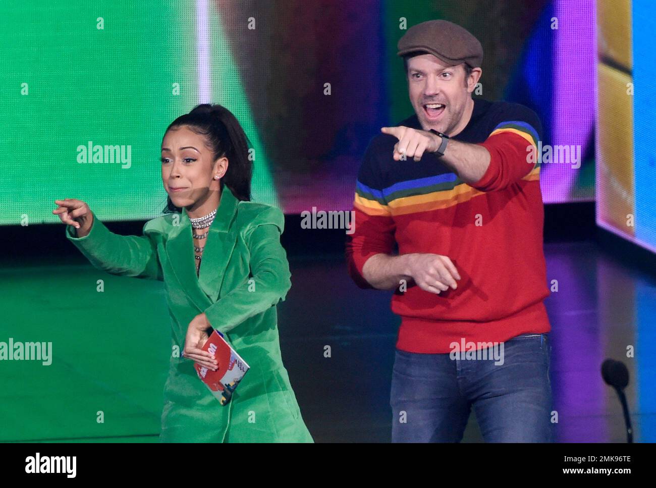 Liza Koshy, left, and Jason Sudeikis present the award for favorite butt-kicker at the ...