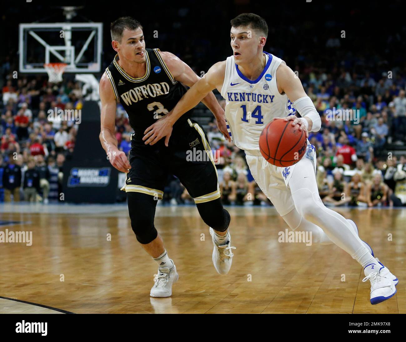 Kentucky's Tyler Herro (14) drives around Wofford's Fletcher Magee (3 ...
