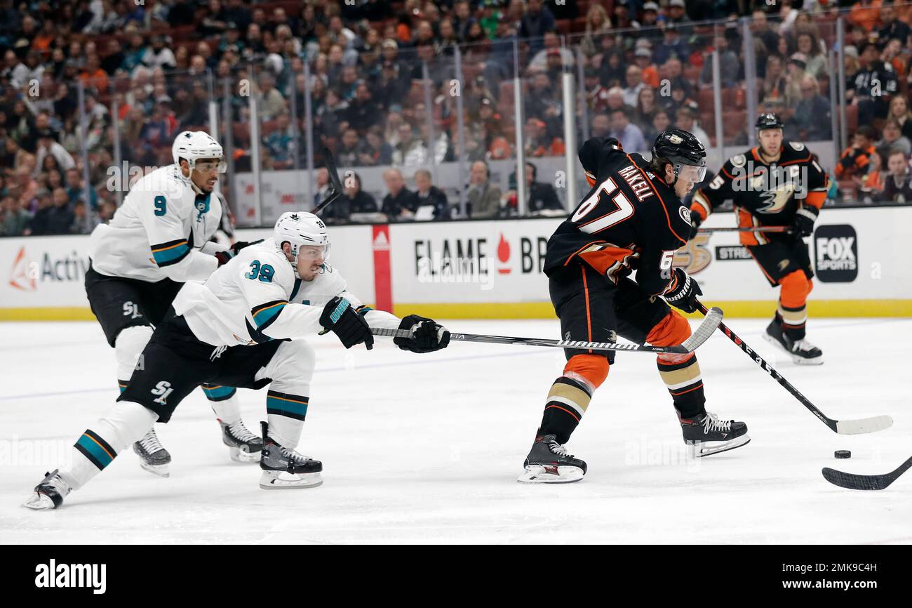 Anaheim Ducks' Rickard Rakell, right, is defended by San Jose Sharks ...